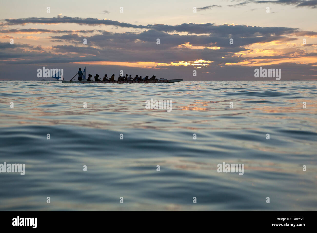 People rowing at sunset in Boracay, Philippines Stock Photo - Alamy