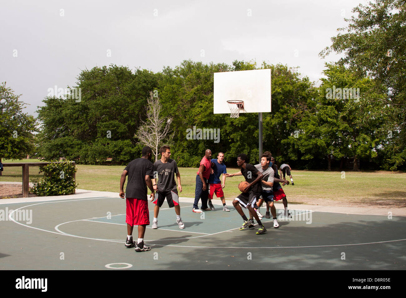 Group Of Guys Playing Basketball Stock Photo - Alamy