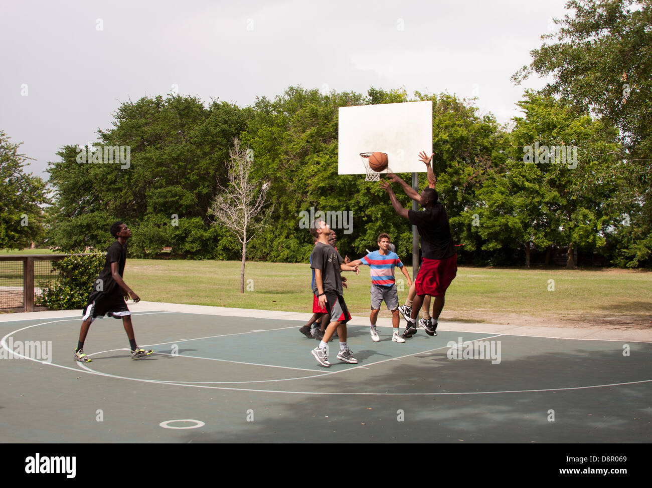 Group Of Guys Playing Basketball Stock Photo - Alamy