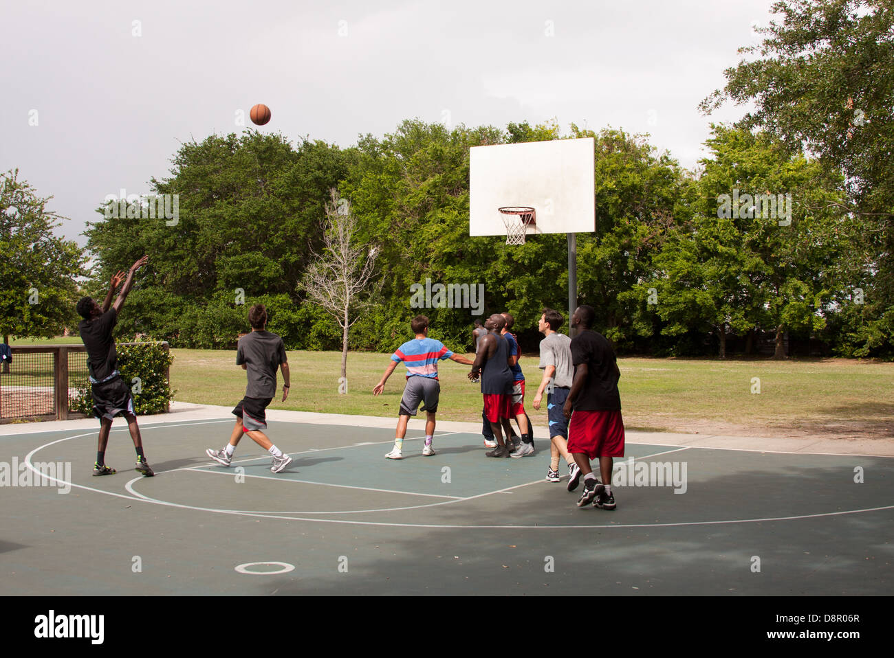 Group Of Guys Playing Basketball Stock Photo - Alamy