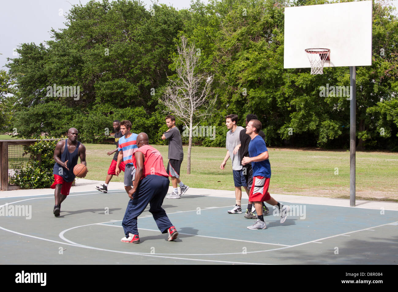 Group Of Guys Playing Basketball Stock Photo - Alamy