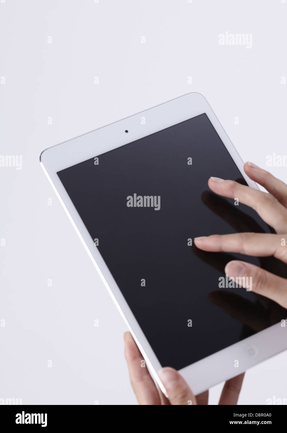 Hands using a tablet PC Stock Photo - Alamy