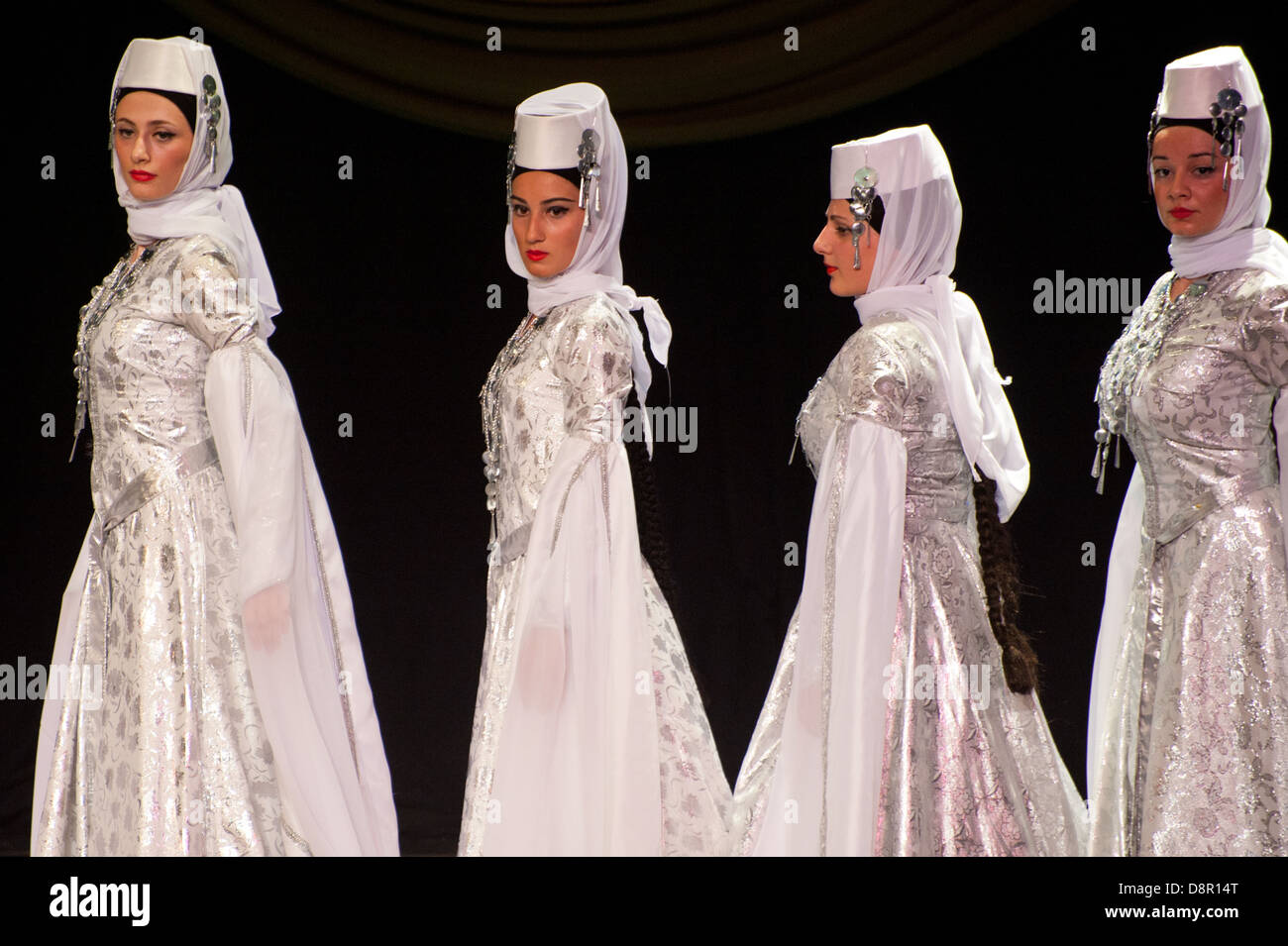 Georgian children dressed with traditional costumes dancing a folklore ...