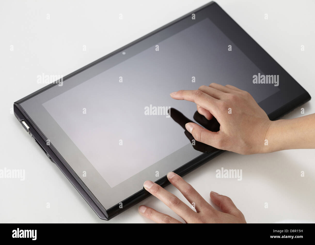 Hands using a tablet PC Stock Photo - Alamy