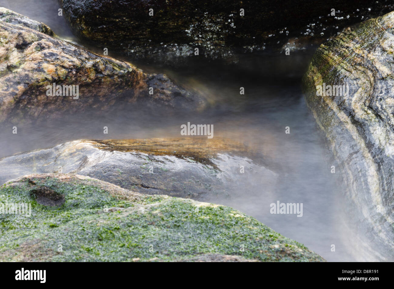 waves over rocks Stock Photo - Alamy