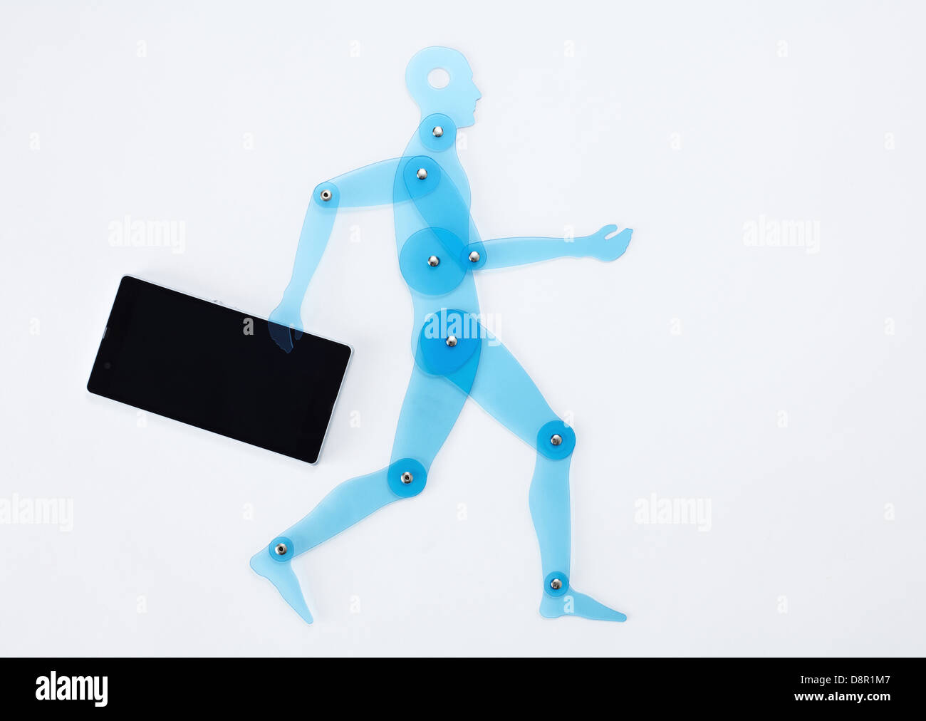 Human-shaped ruler holding a smartphone Stock Photo - Alamy