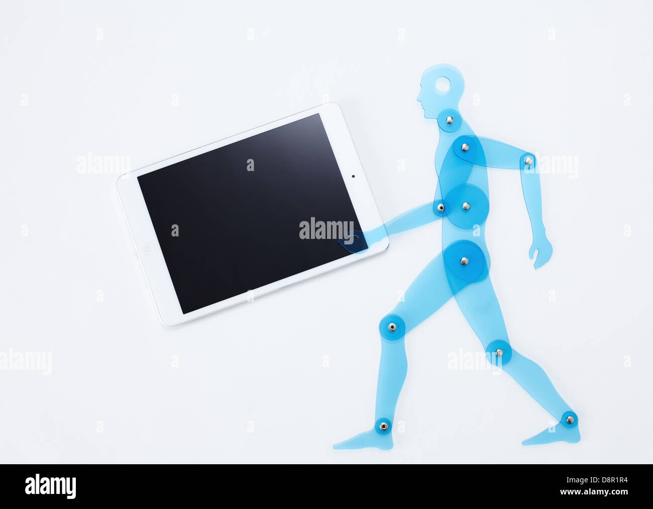 Human-shaped ruler holding a tablet PC Stock Photo - Alamy
