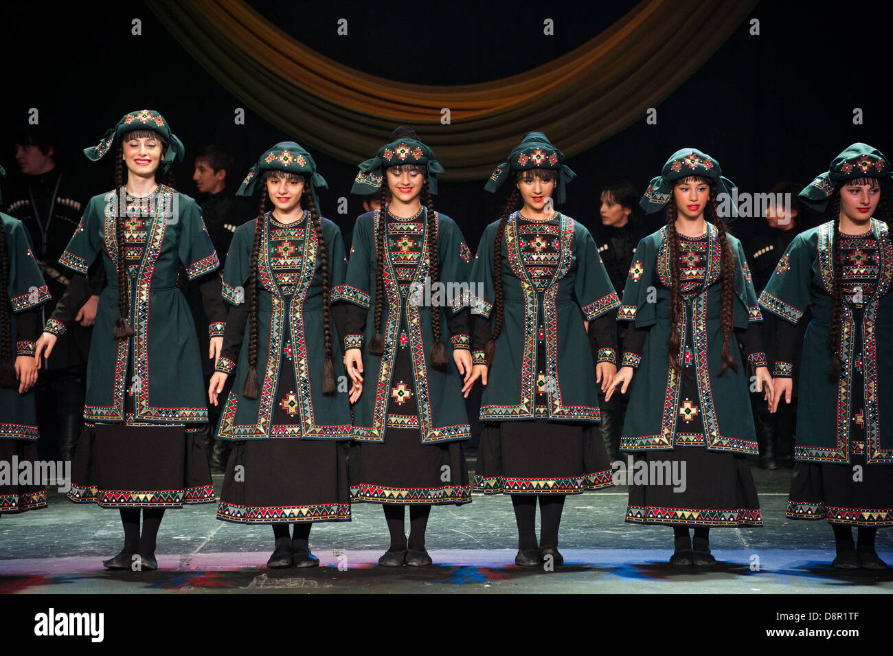 Georgian children dressed with traditional costumes dancing a folklore ...