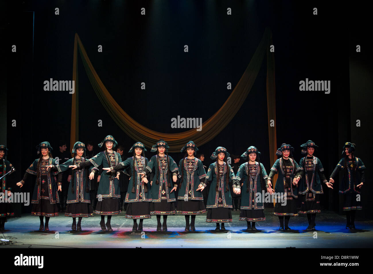 Georgian children dressed with traditional costumes dancing a folklore ...