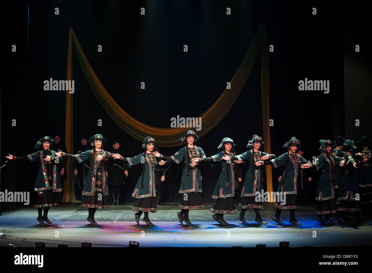 Georgian children dressed with traditional costumes dancing a folklore ...