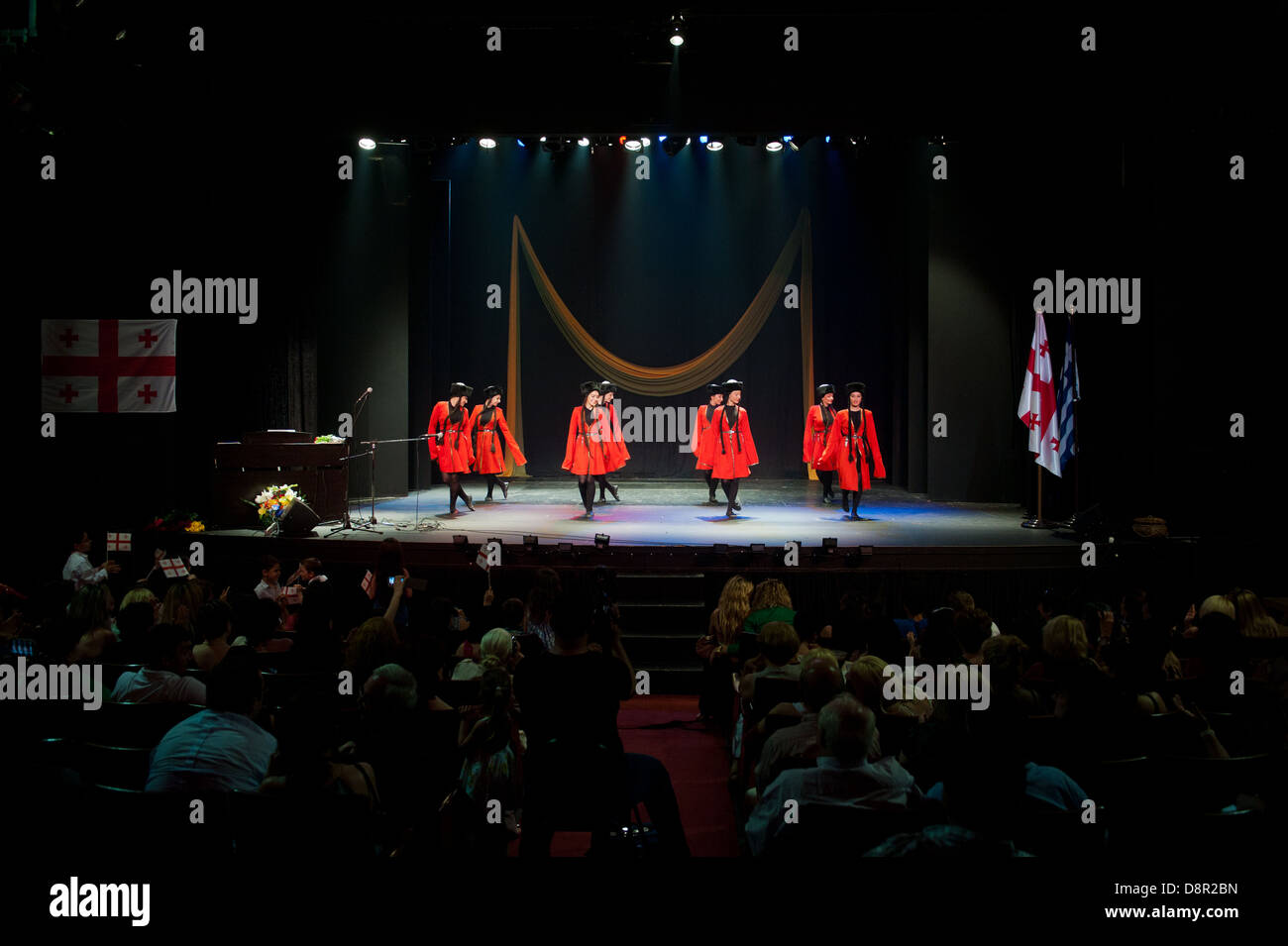 Georgian children dressed with traditional costumes dancing a folklore ...