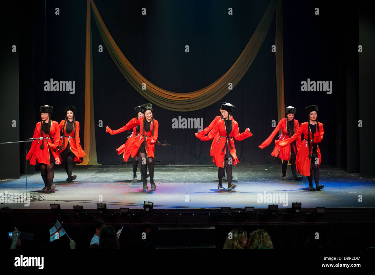 Georgian children dressed with traditional costumes dancing a folklore ...