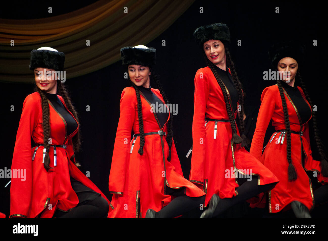 Georgian children dressed with traditional costumes dancing a folklore ...