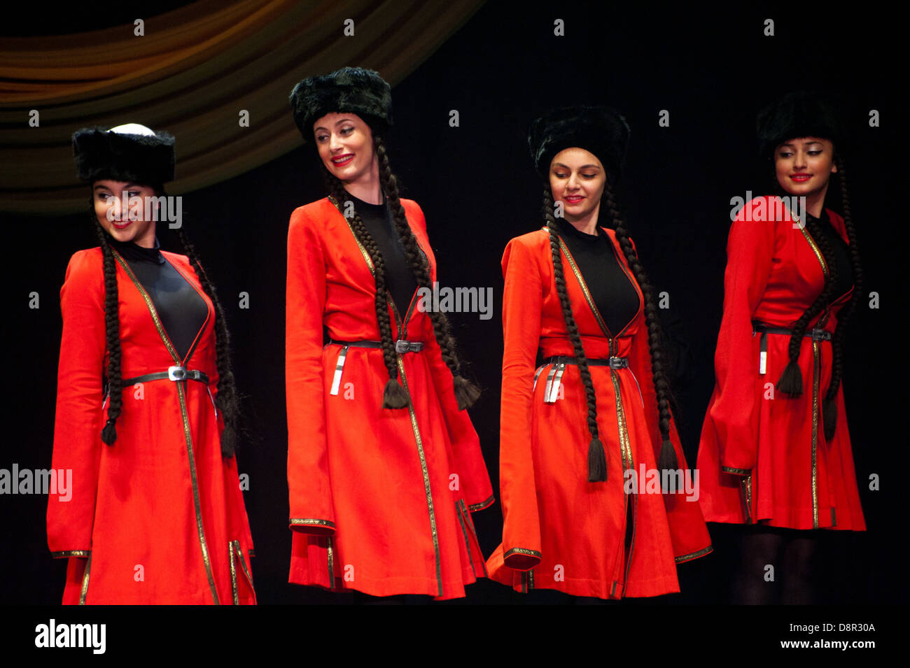 Georgian children dressed with traditional costumes dancing a folklore ...