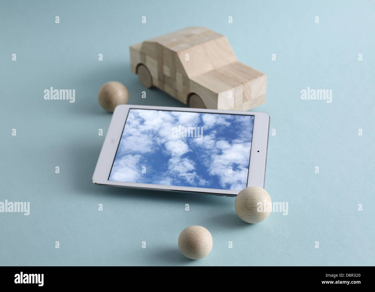Wooden toy car and a tablet PC Stock Photo - Alamy