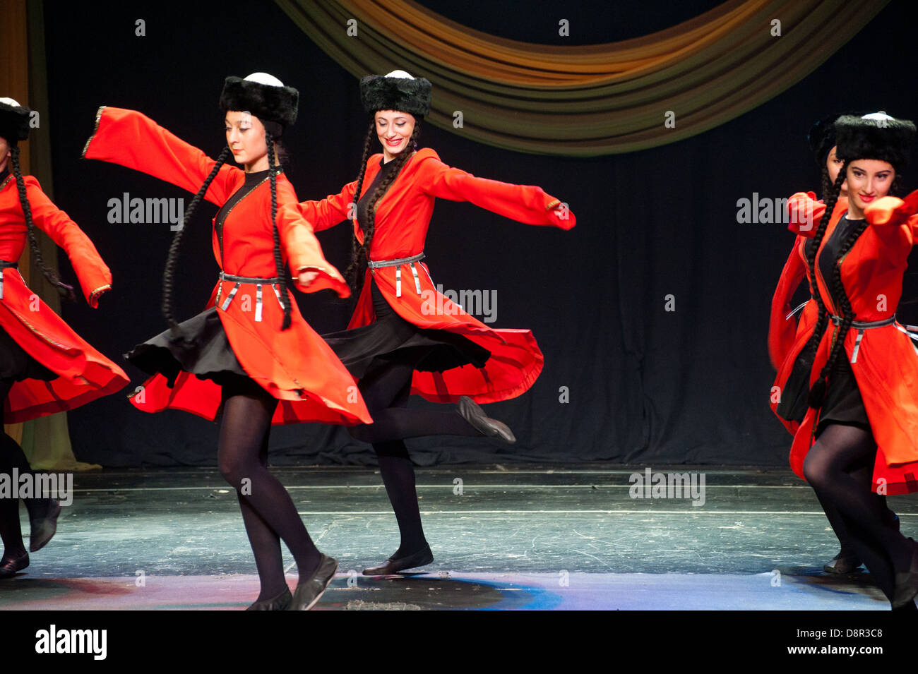 Georgian children dressed with traditional costumes dancing a folklore ...