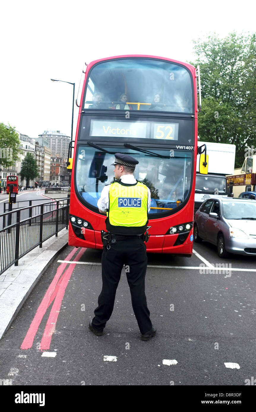 London bus and police Stock Photo - Alamy
