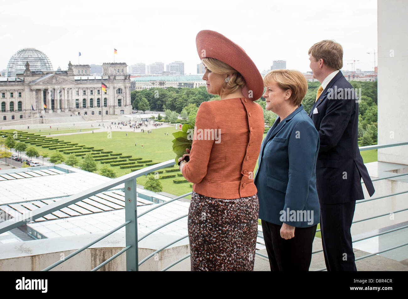 HANDOUT - A handout picture shows German Chancellor Angela Merkel (C ...