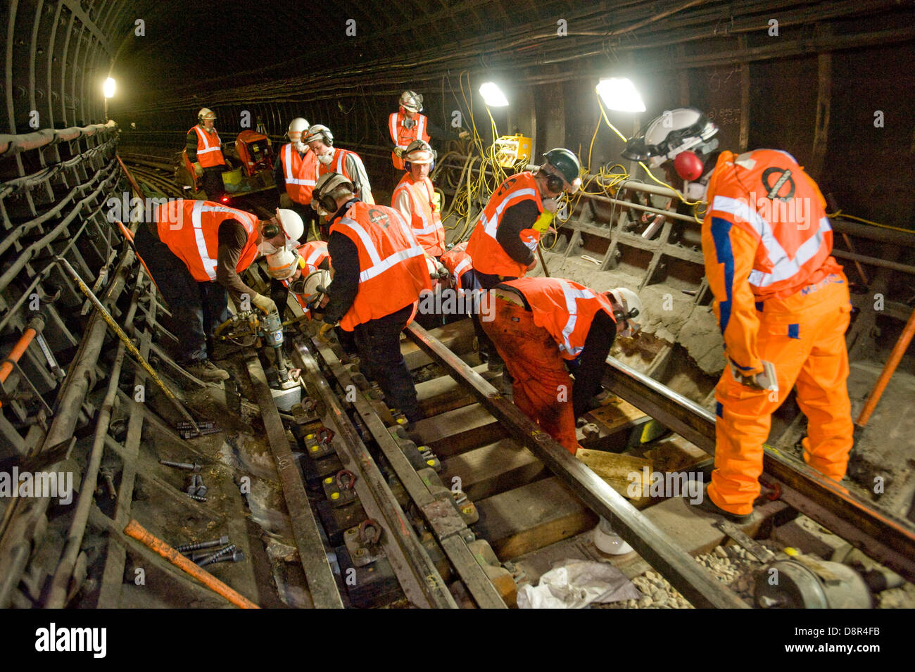 Workers set about digging, bagging up and hauling the old concrete ...