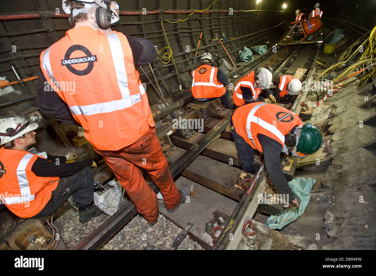 Workers set about digging, bagging up and hauling the old concrete ...