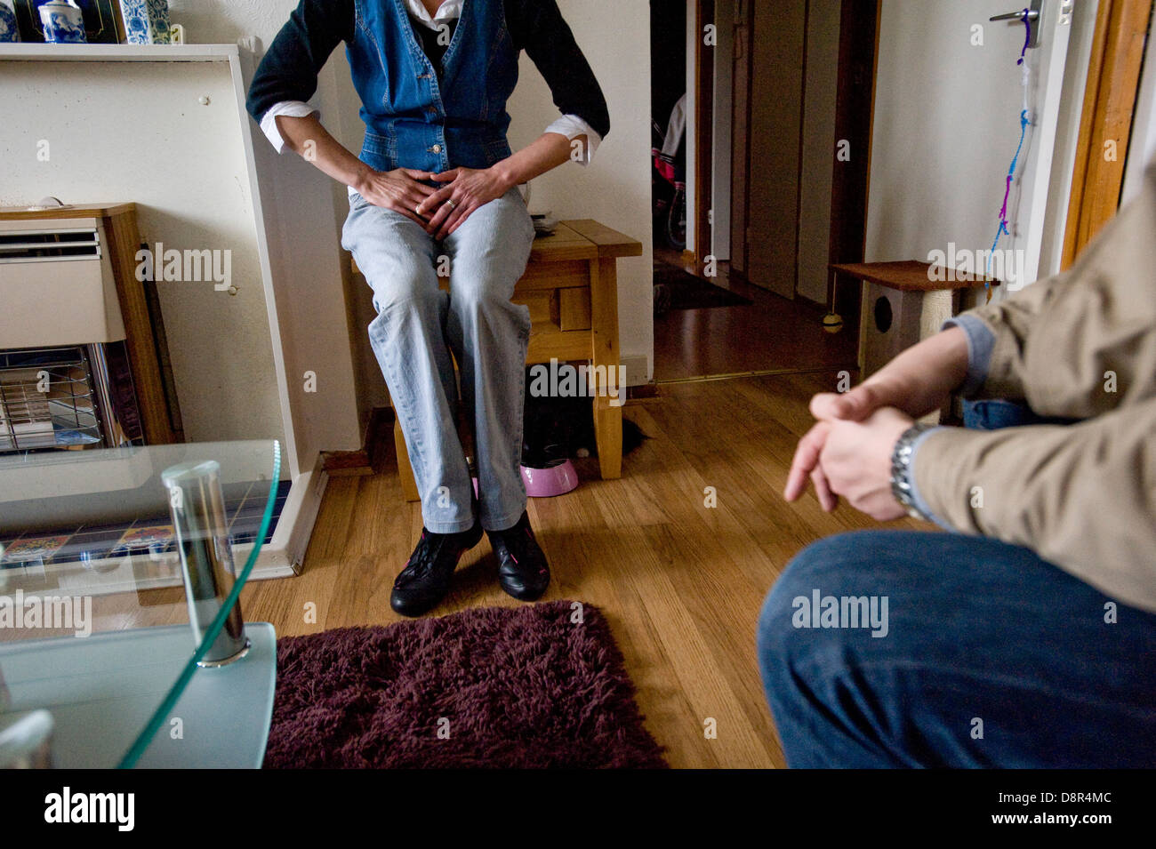 A recently qualified child protection social worker on a home visit ...