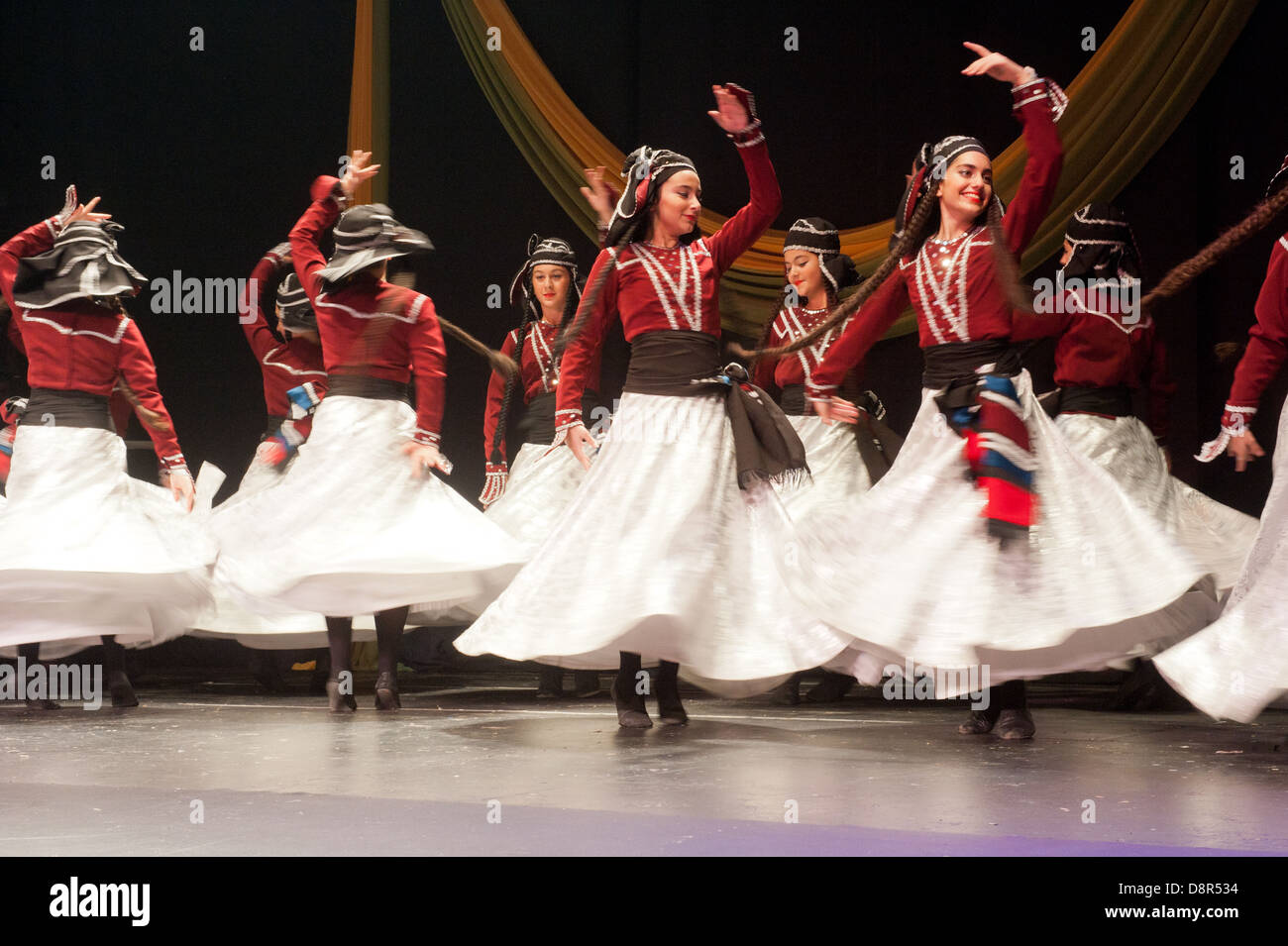Georgian children dressed with traditional costumes dancing a folklore ...