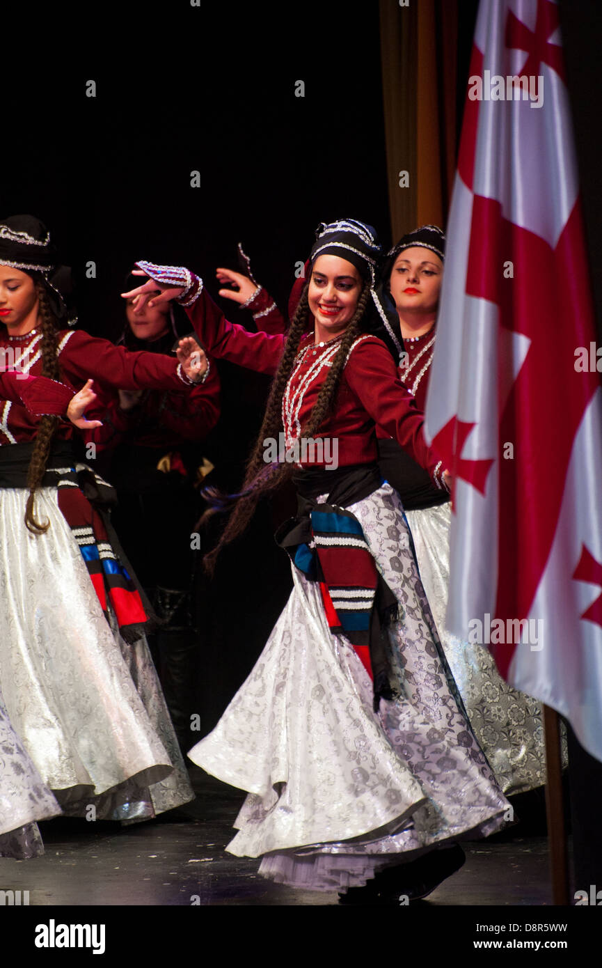 Georgian children dressed with traditional costumes dancing a folklore ...