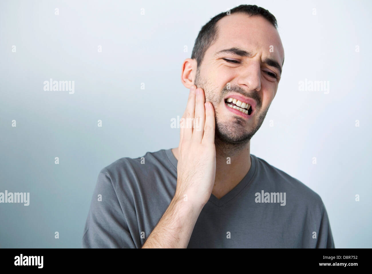 MAN WITH TOOTHACHE Stock Photo - Alamy