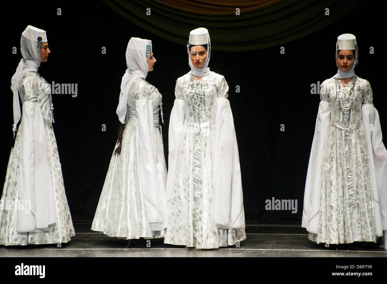 Georgian children dressed with traditional costumes dancing a folklore ...
