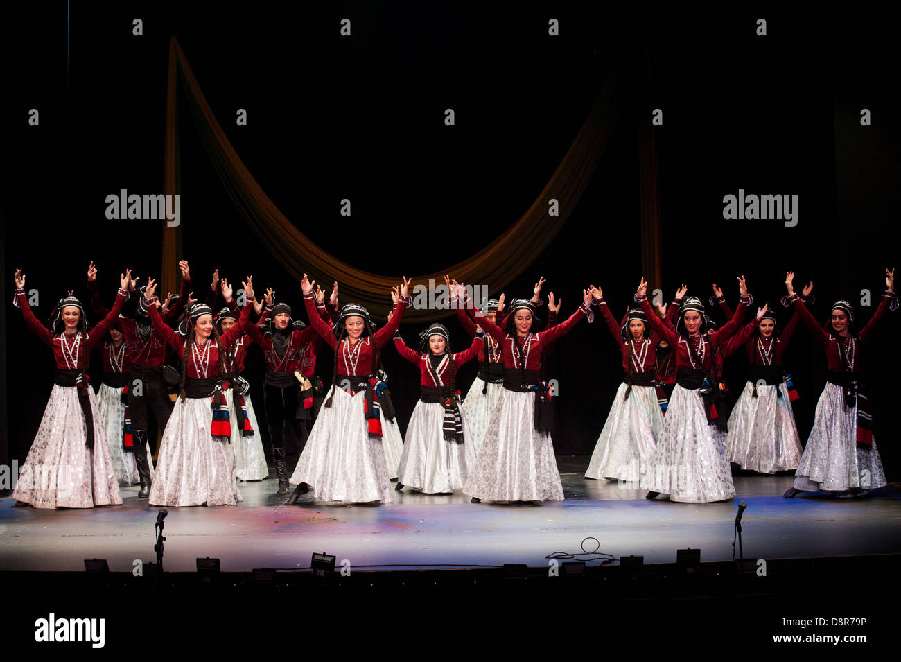Georgian children dressed with traditional costumes dancing a folklore ...