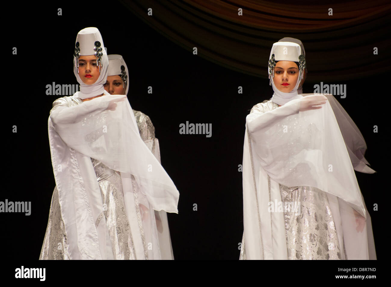Georgian children dressed with traditional costumes dancing a folklore ...
