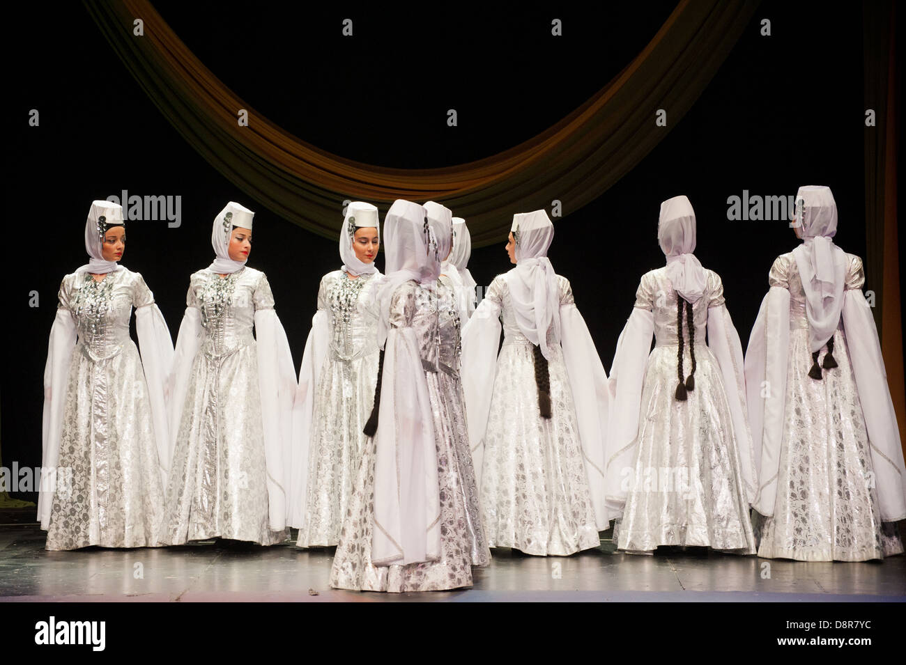 Georgian children dressed with traditional costumes dancing a folklore ...