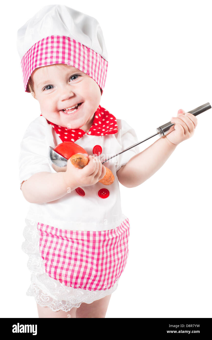 Baby girl wearing a chef hat with vegetables and pan isolated on white ...