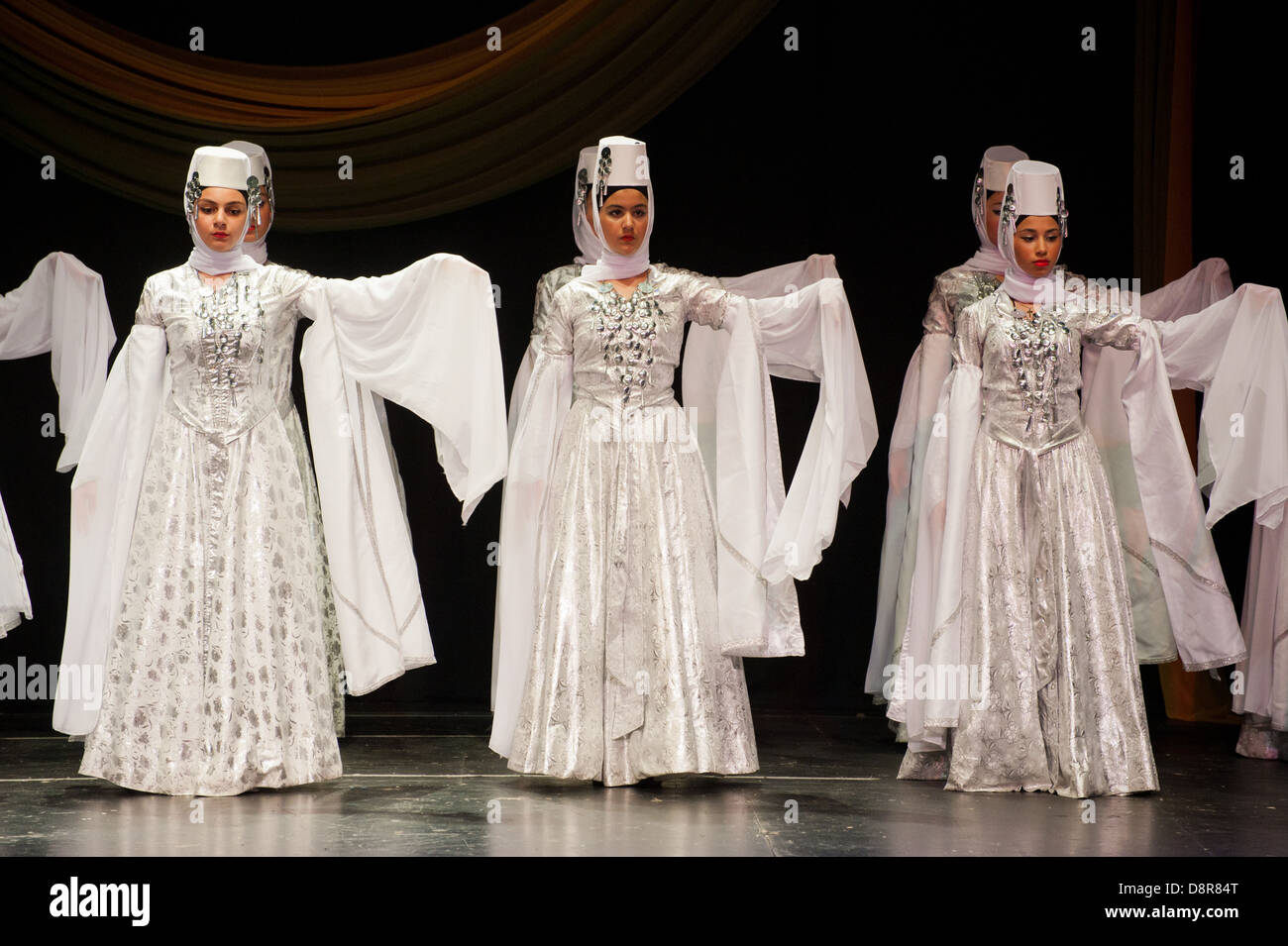Georgian children dressed with traditional costumes dancing a folklore ...