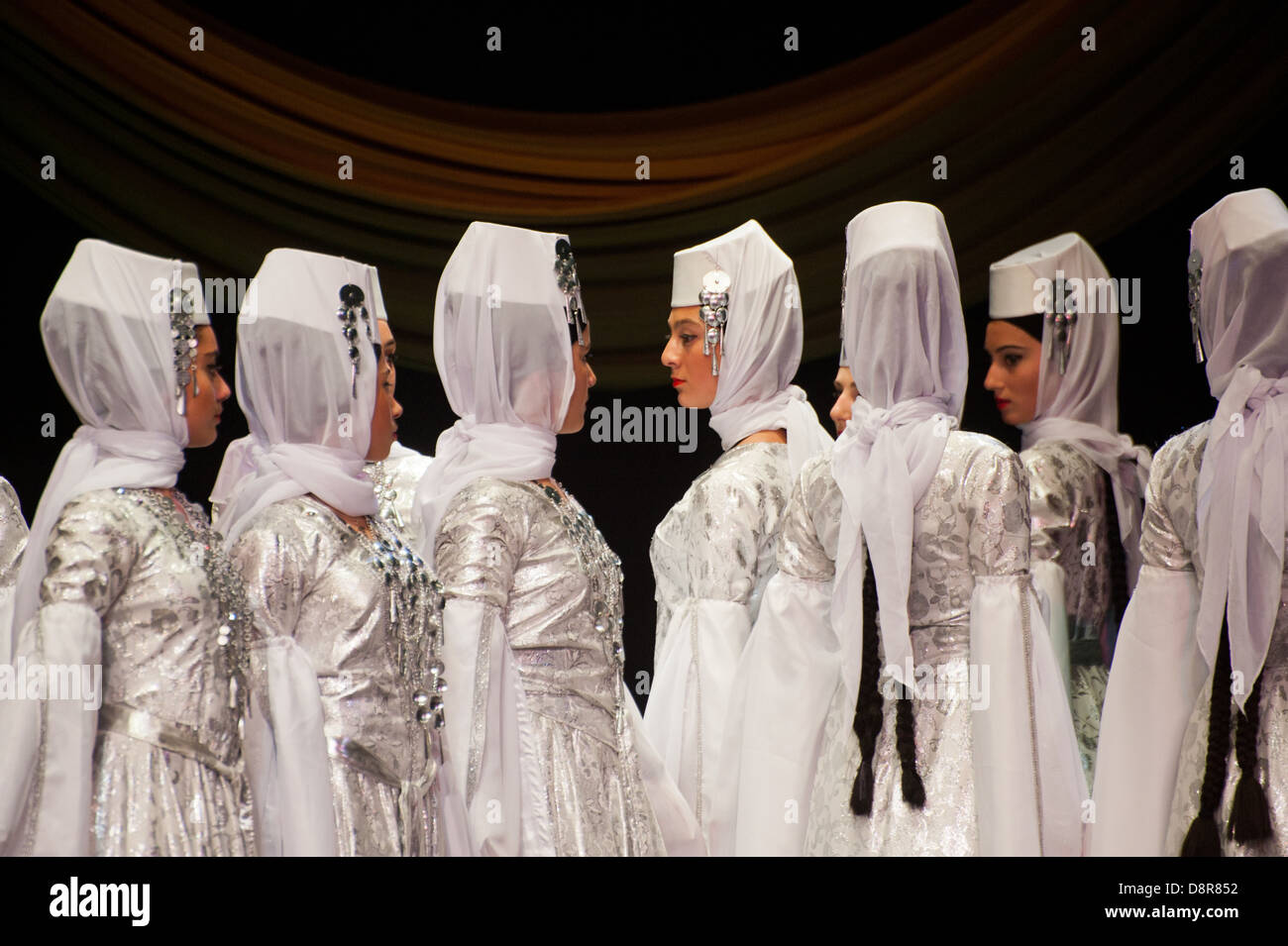 Georgian children dressed with traditional costumes dancing a folklore ...