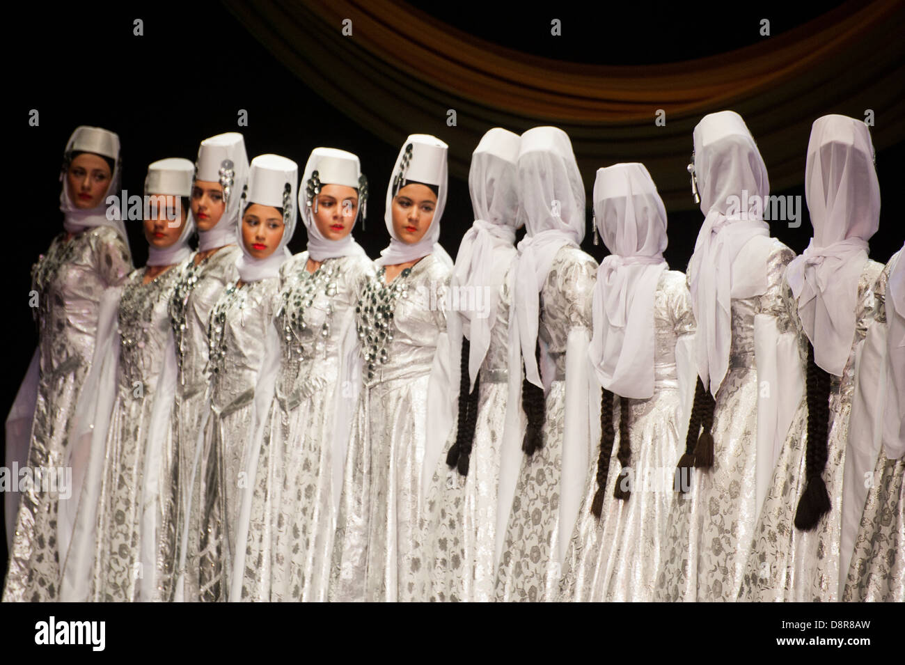 Georgian children dressed with traditional costumes dancing a folklore ...