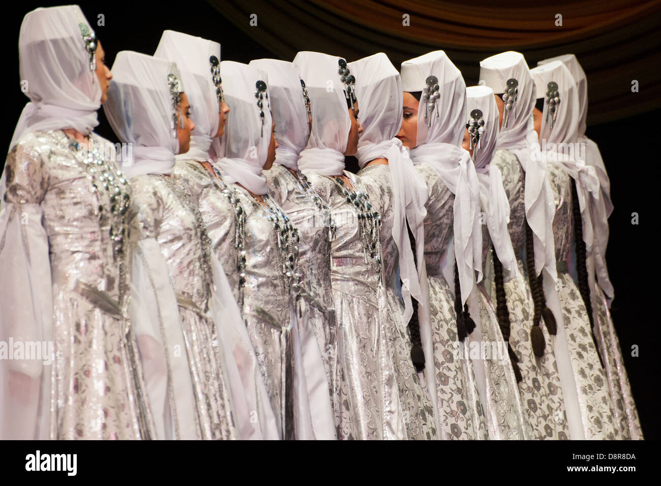 Georgian children dressed with traditional costumes dancing a folklore ...