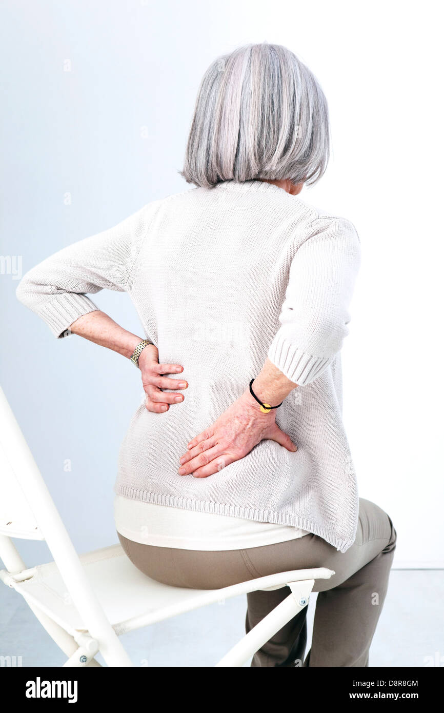 LOWER BACK PAIN IN ELDERLY PERSON Stock Photo - Alamy