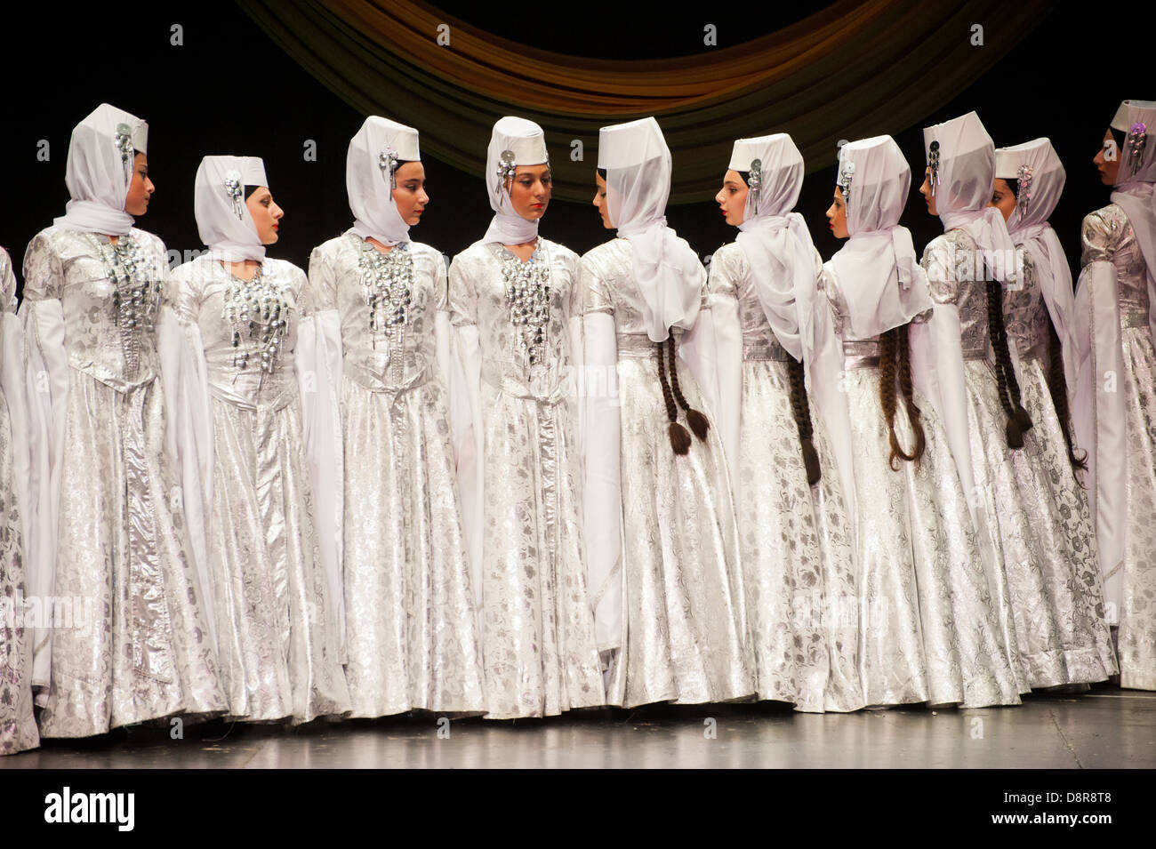 Georgian children dressed with traditional costumes dancing a folklore ...