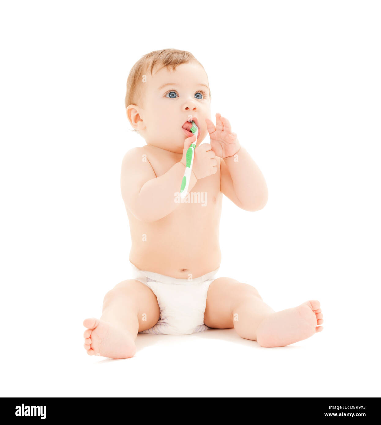 curious baby brushing teeth Stock Photo - Alamy