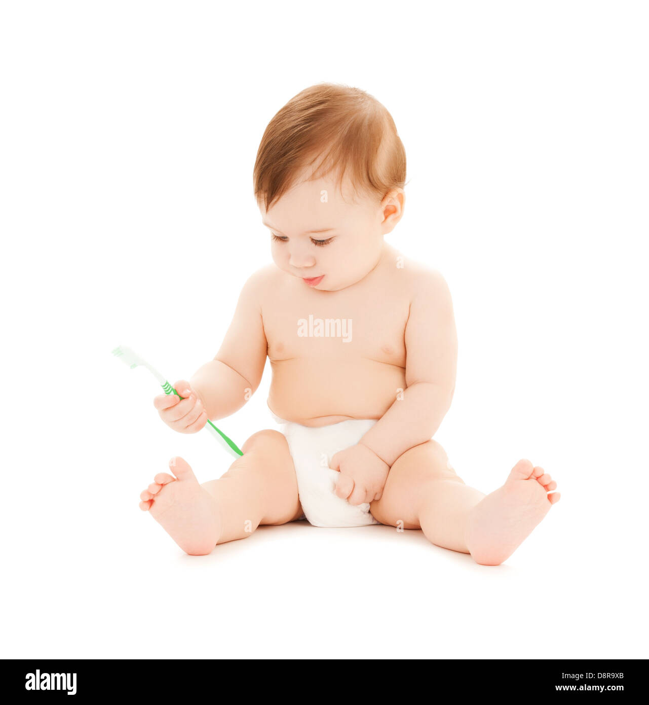 curious baby brushing teeth Stock Photo - Alamy