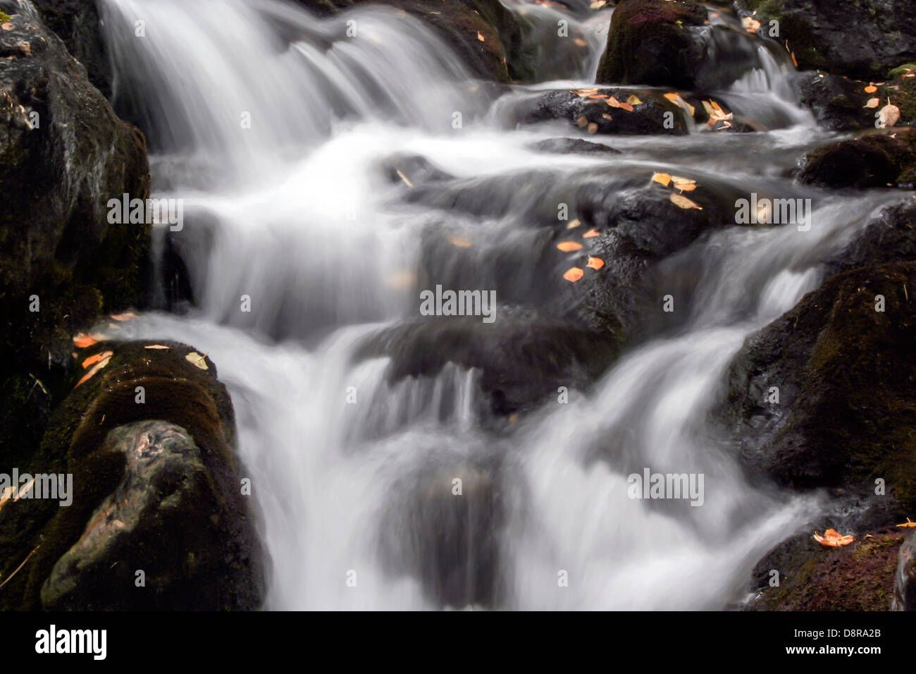 Flowing water from mountain waterfall Stock Photo - Alamy