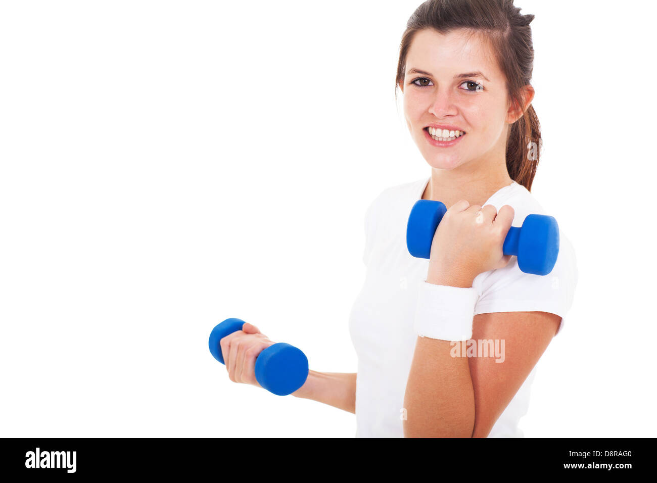 pretty teen girl exercising with dumbbells on white background Stock ...