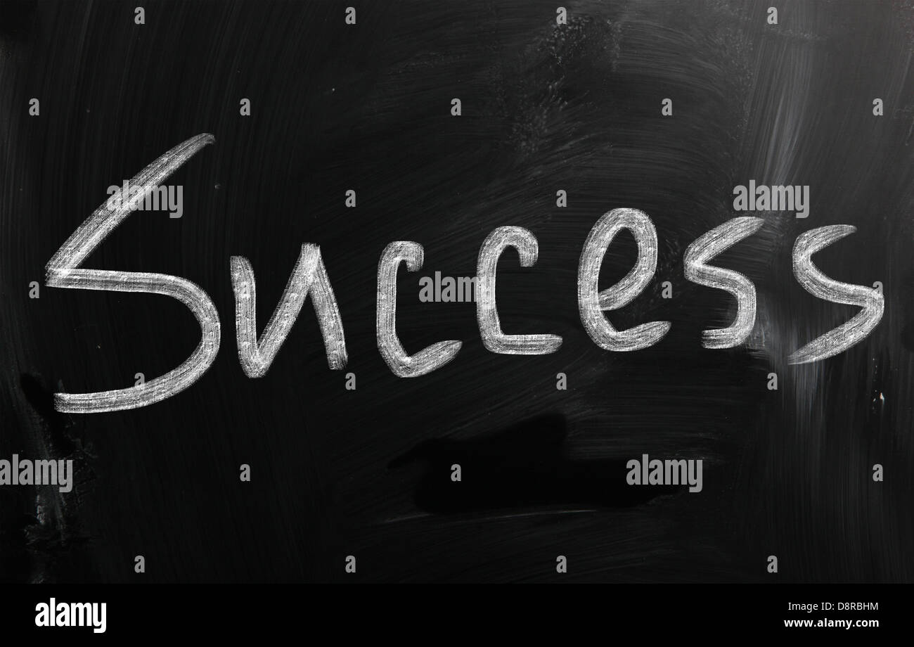 The word 'Success' handwritten with white chalk on a blackboard Stock ...