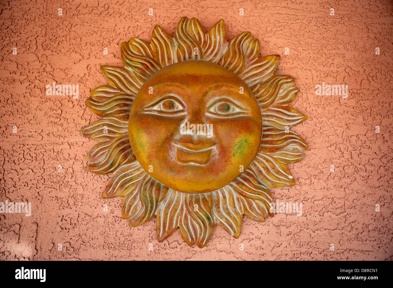 A relief of the sun on a wall in Arizona Stock Photo - Alamy