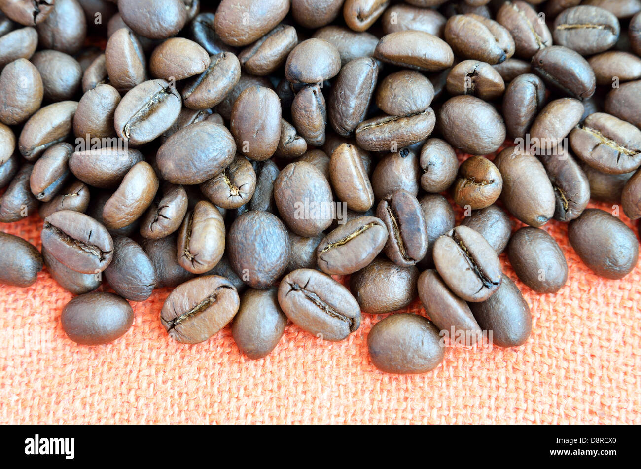 Coffee beans on textile background Stock Photo - Alamy