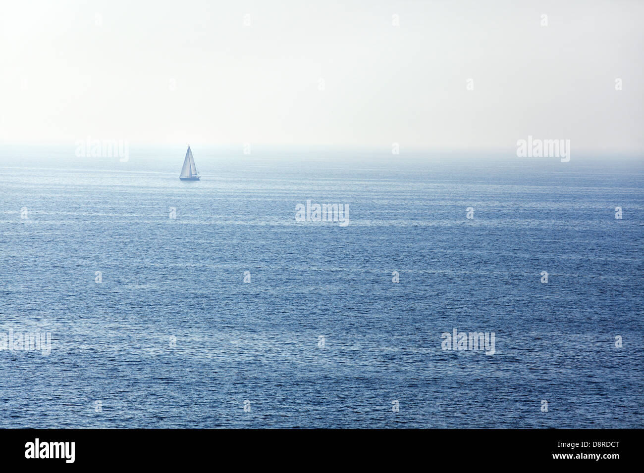 Sailing ship on a wide blue ocean Stock Photo - Alamy