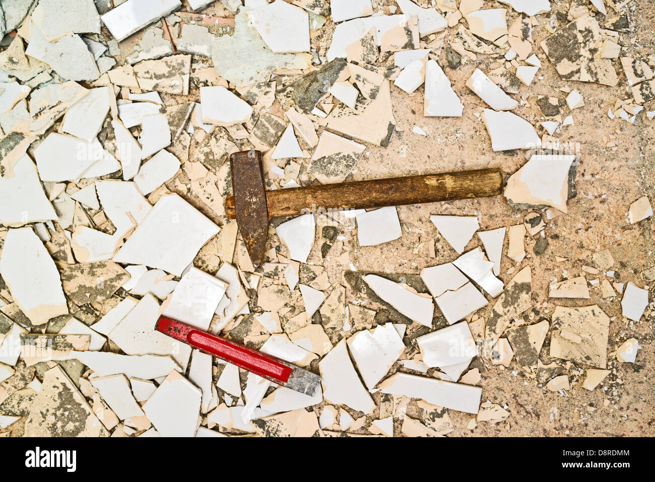 Man breaking ceramic tiles in the bathroom, home redecoration Stock ...