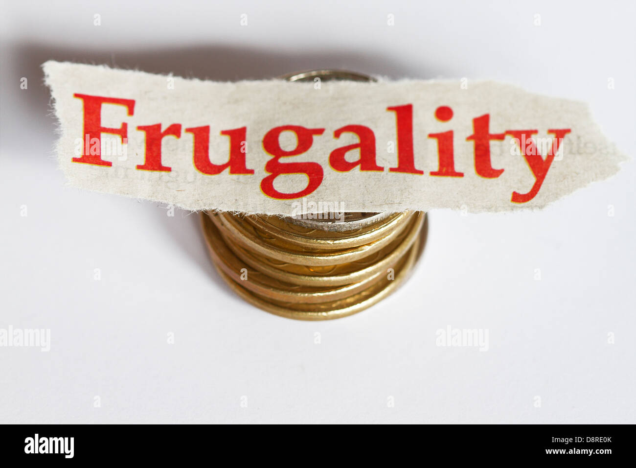 Frugality concept - with coins in white background Stock Photo - Alamy