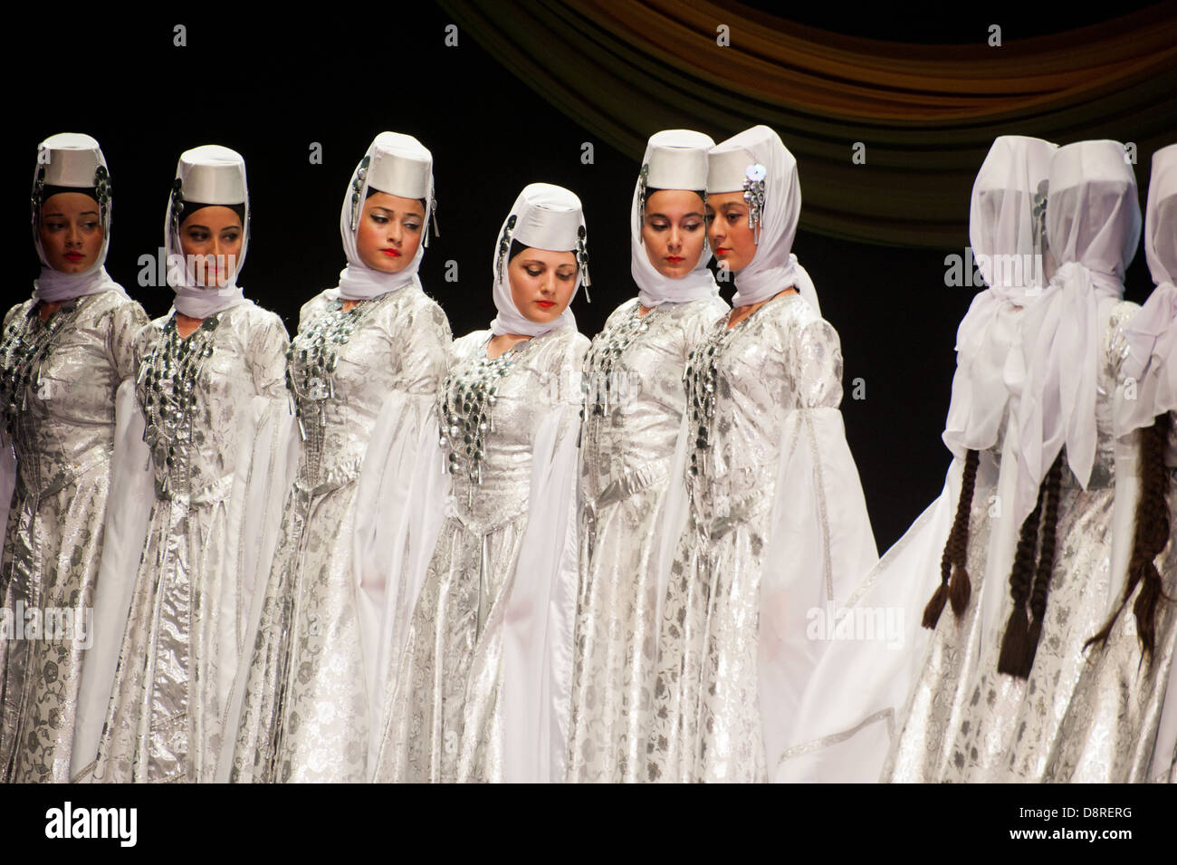 Georgian children dressed with traditional costumes dancing a folklore ...